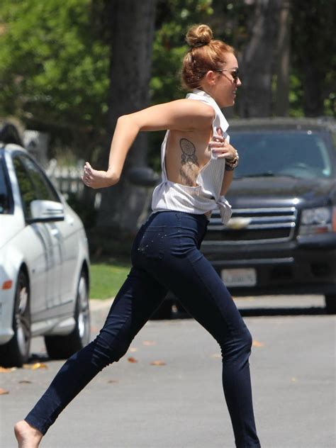 Miley Cyrus Braless Showing Side Boob In A Wide Open Top Out In Toluca