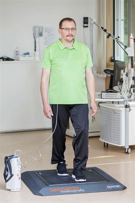 Copd Patient Performing A Semi Tandem Stance Balance Test On A Force