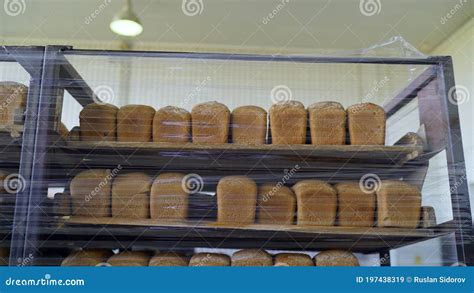 Bread On Shelves Under Cling Film Freshly Baked Bread Trays In A Row