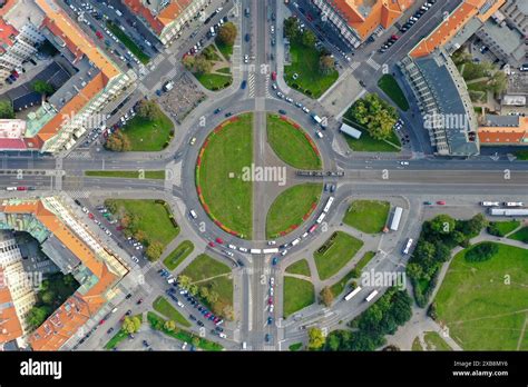 An Overhead View Of A Bustling Urban Intersection With Numerous Streets And Buildings Stock