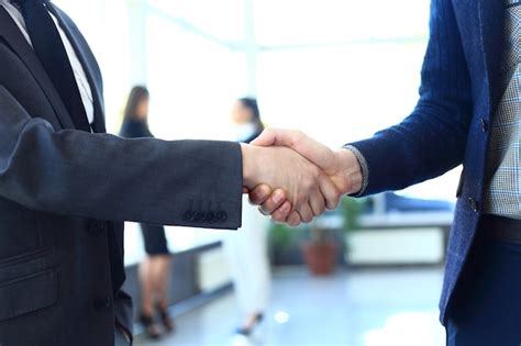 Premium Photo Businesss And Office Concept Two Businessmen Shaking