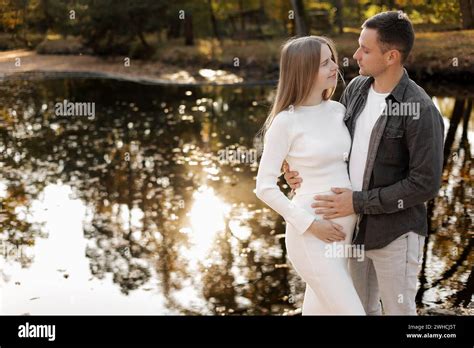 Family day. Stylish marriage pregnant couple waiting for baby. Man is ...
