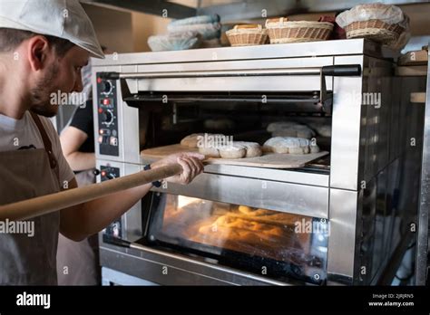 The Process Of Making Traditional French Bread In An Artisan Bakery
