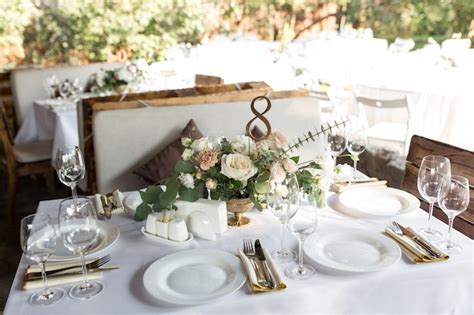 Premium Photo Wedding Table Setting Decorated With Fresh Flowers In A