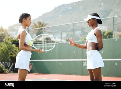 What Will The Outcome Be Two Sporty Young Women Flipping A Coin Before