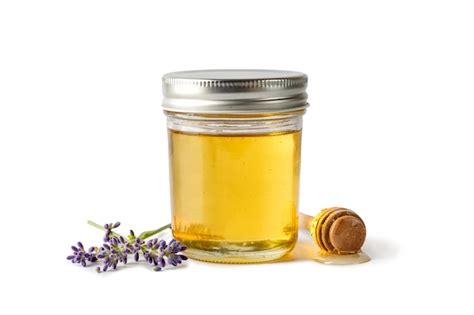 Premium Photo Glass Jar Of Lavender Honey With Wooden Honey Dipper