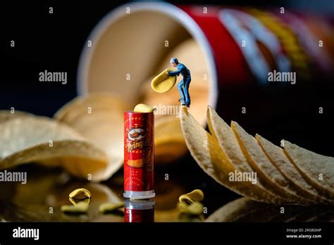 Pringles Miniature Worker Is Packing Or Unpacking A Tiny Packet Of