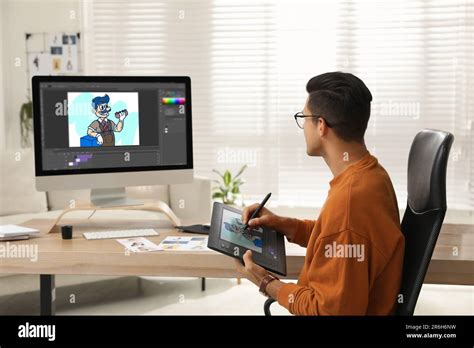 Animator Using Graphic Tablet And Computer Illustration On Screens