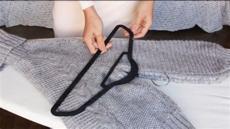 How To Hang Your Sweaters Without Ruining Them Sweater Hanging