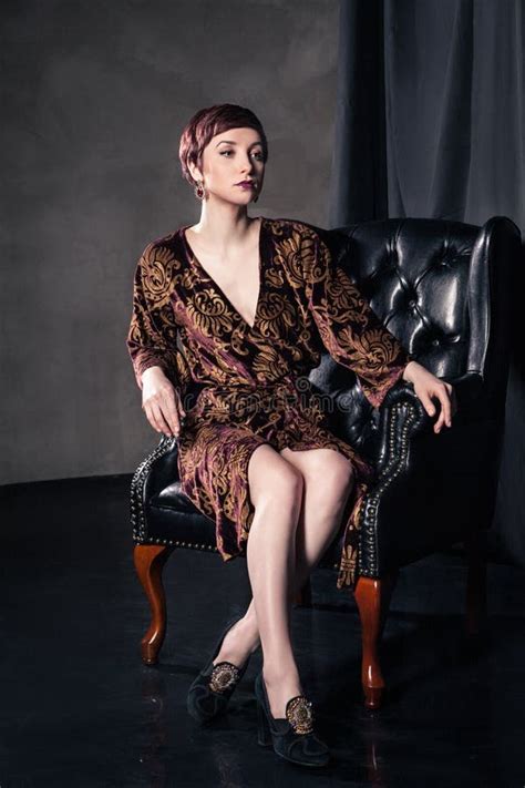 Beautiful Woman Wearing Short Dress Sitting In Stock Image Image Of