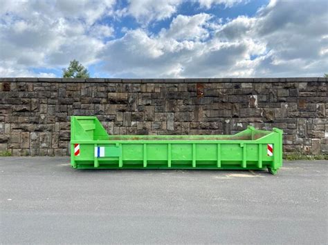 Premium Photo Garbage Container Against Blue Wall In City