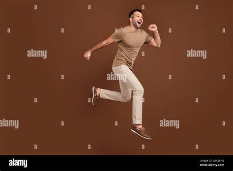 Full Length Body Size Man In Casual Outfit Running Jumping Up Overjoyed