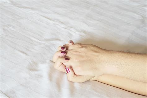 Man Holding Woman Hand On White Bed Couple Sexual Concept Stock Photo At Vecteezy