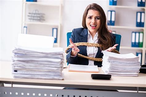 The Young Beautiful Employee Tied Up With Rope In The Office Young