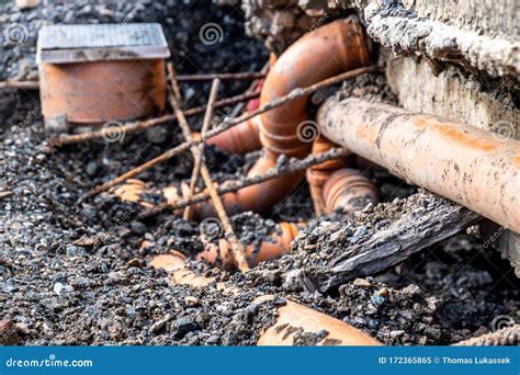 Broken Pipes Due To Subsidence In The Soil Around The House Stock Image