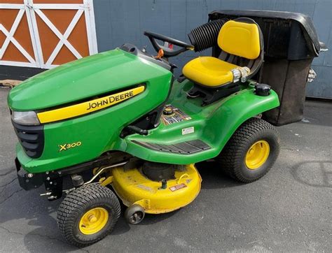 John Deere X300 Tractor And Bagging System