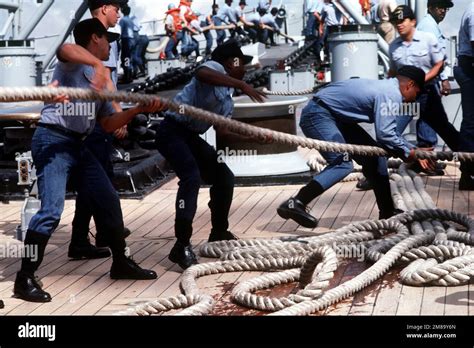 Crew Members Aboard The Battleship Uss Missouri Bb 63 Handle The