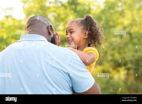 Father Laughing And Playing With His Daugher Stock Photo Alamy