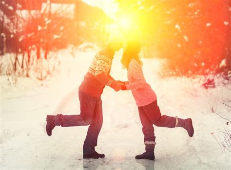 Premium Photo Young Happy Couple In Love Holding Hands And Kissing