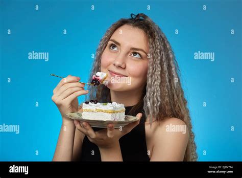 Fun Pretty Curly Blond Hair Girl With Sweet Dessert On Blue Background