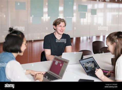 Three Colleagues Sitting Business Meeting Hi Res Stock Photography And