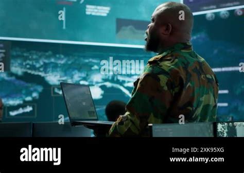 Military Officer Oversees Surveillance And Cybersecurity Operations In A High Tech Army Command