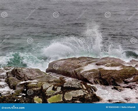 Ocean Waves Splash Against Shore Rocks In Jamestown Rhode Island Stock
