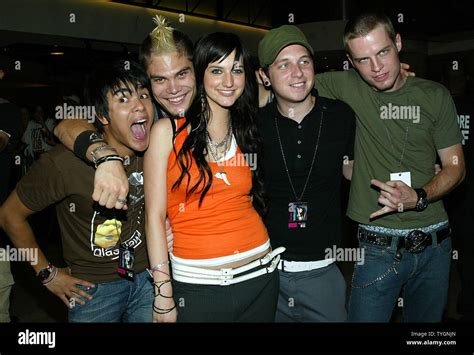 Ashlee Simpson Poses With Her Band Before Signing Copies Of Her New Cd