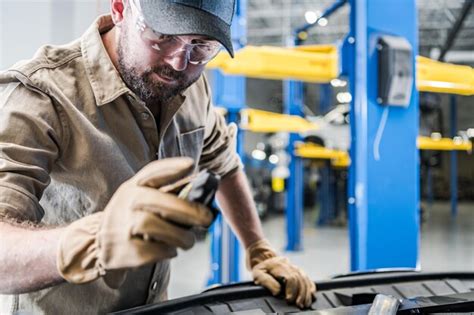 Premium Photo Caucasian Automotive Technician Worker Wearing Eyes