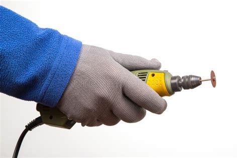 Engraving Tool For Cutting And Processing Metal And Other Objects In Hand On A White Background