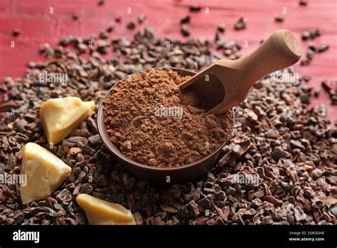 Composition With Cocoa Nibs Butter And Powder On Wooden Background