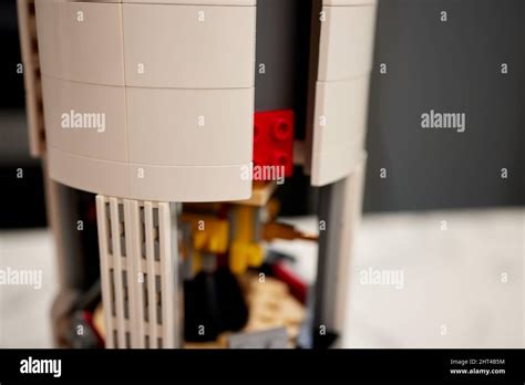 assembling a rocket constructor colored plastic small blocks stock