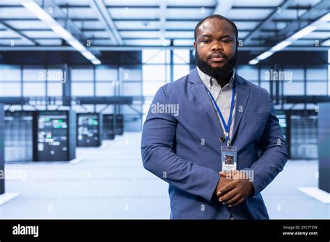 Engineer In Server Room Implementing And Maintaining Security Measures To Protect Data And