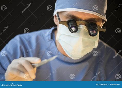 Scalpel In Surgeon Hand Isolated White Royalty Free Stock Image