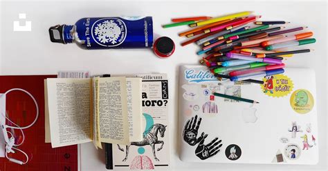 marker lot beside book photo free wristwatch image on unsplash