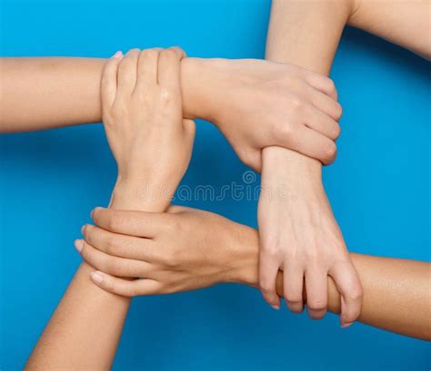 Unrecognizable Women Holding Hands Symbolizing Togetherness Blue