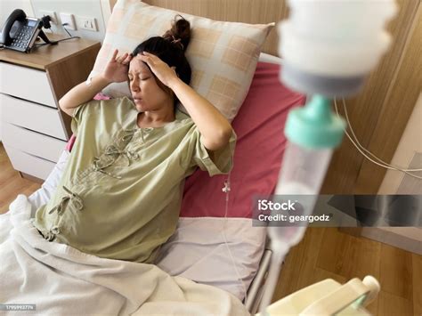 Stressed Pregnant Woman Patient Suffering Headache On Bed In Hospital