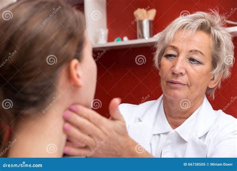 Doctor Examines A Young Patient Stock Image Image Of Examining