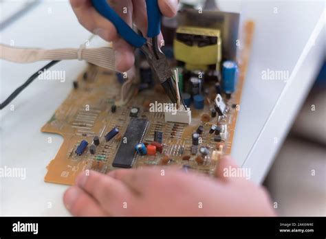 Group Of Young Engineers Working On Robotics Project Scientist Engineers Designing Small Human