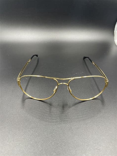 Oakley Caveat Polished Gold Frame Gem
