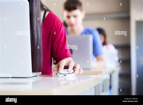 Close Up Of A Hand Clutching A Mouse In A High Babe Classroom A Group Of Cheerful Babes