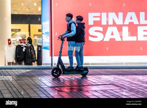 2 Teenagers On An E Scooter Sale Final Sale Clothing Department