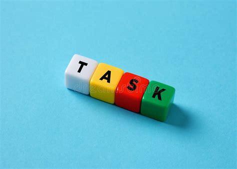 Business Tasks And Project Management Concept The Word Task On Colorful Cubes On Blue