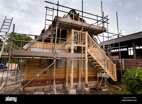 Self Building House Workers Erecting Green Oak Framed Building