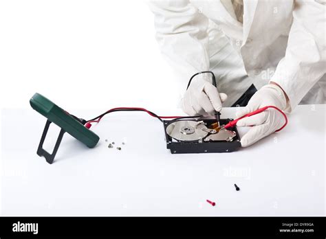 A Technician Repairing A Hard Disk With A Tester Stock Photo Alamy