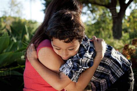 Mother And Son Hugging Outdoors Stock Photo Dissolve