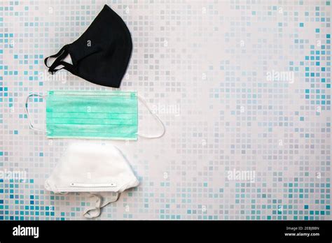 Different Types Of Protective Face Masks On Checkered Background