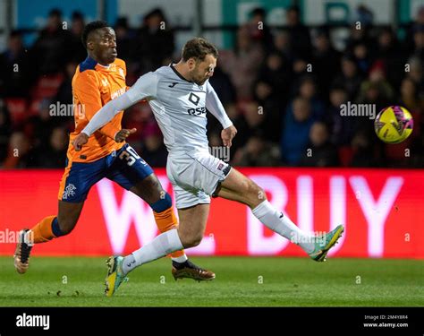 Ross Countys Connor Randall Blocks A Shot From Rangers Malik Tillman
