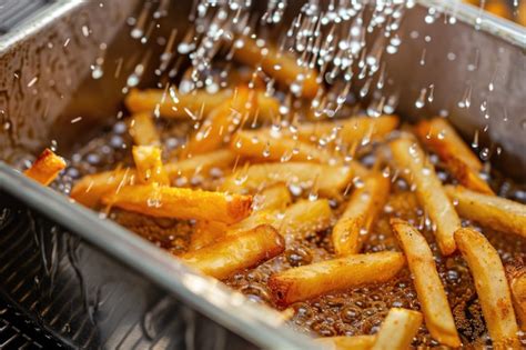 Premium Photo Cooking French Fries Close Up Of Frying French Fries In