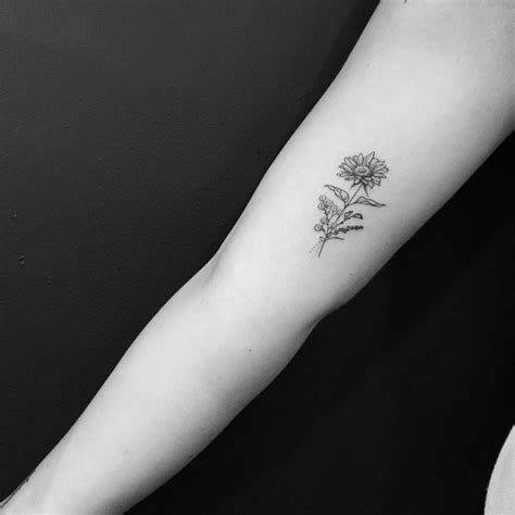 Fine Line Flowers Tattooed On The Inner Arm